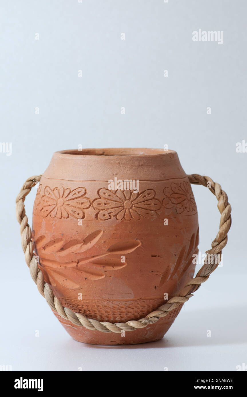 round shaped jar made from clay isolated Stock Photo - Alamy