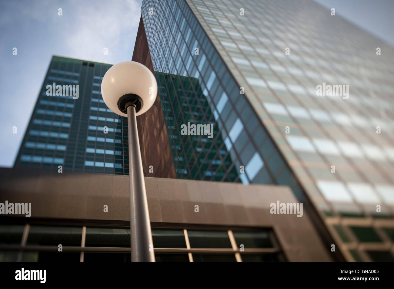 Lamp post in front office building Stock Photo - Alamy