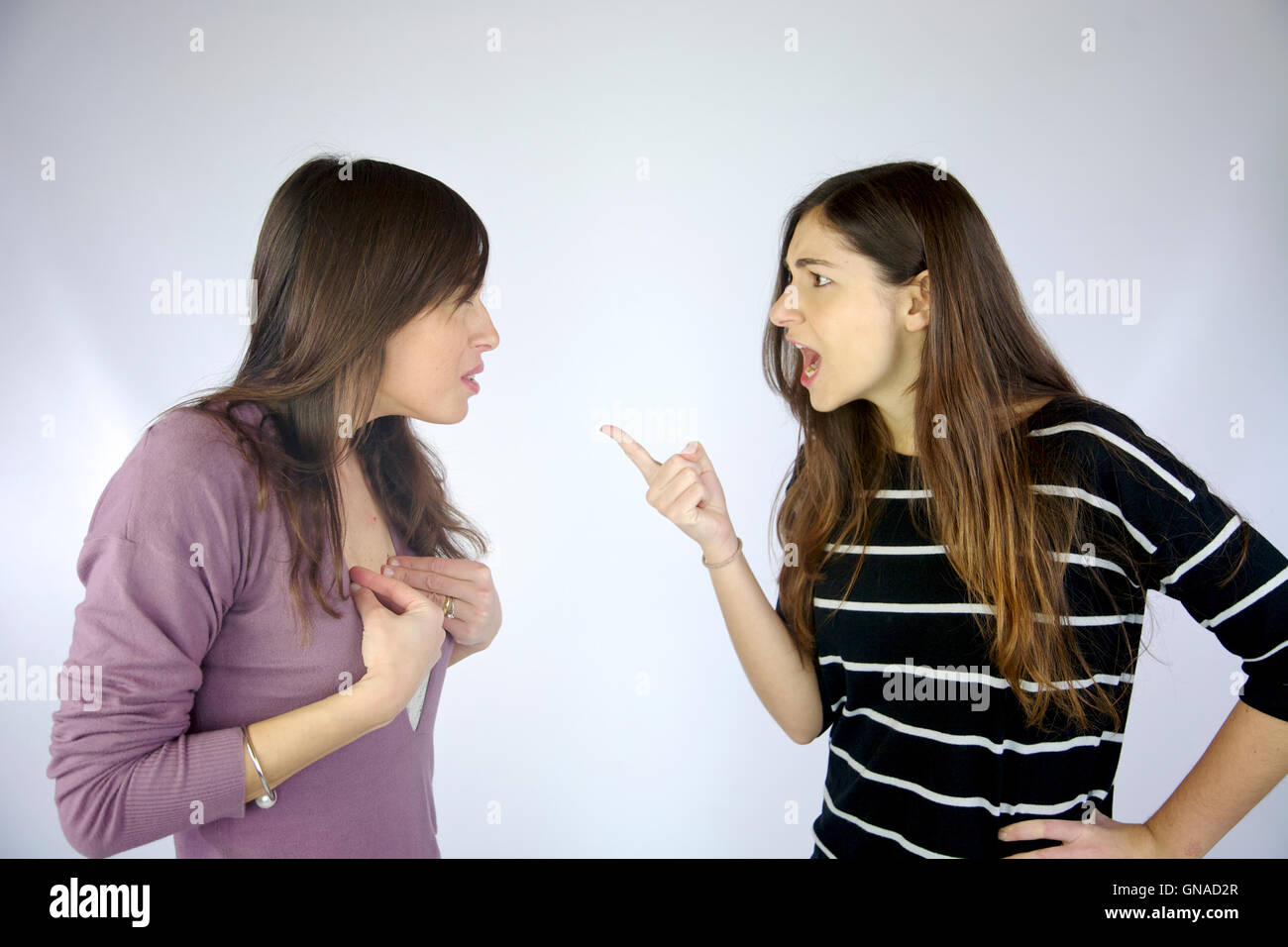 Girls arguing strongly very angry Stock Photo - Alamy