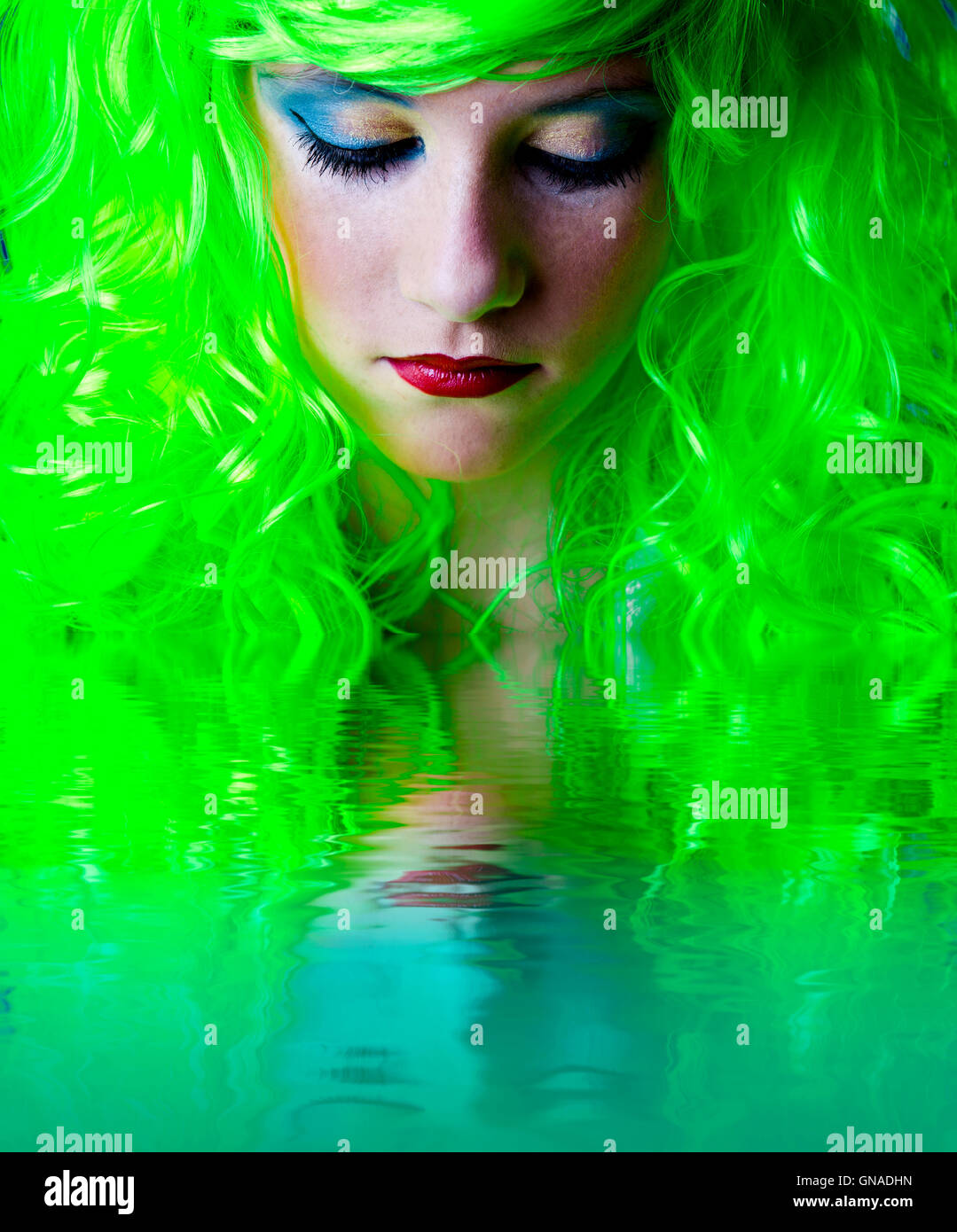 green fairy girl head down with reflection in water Stock Photo - Alamy