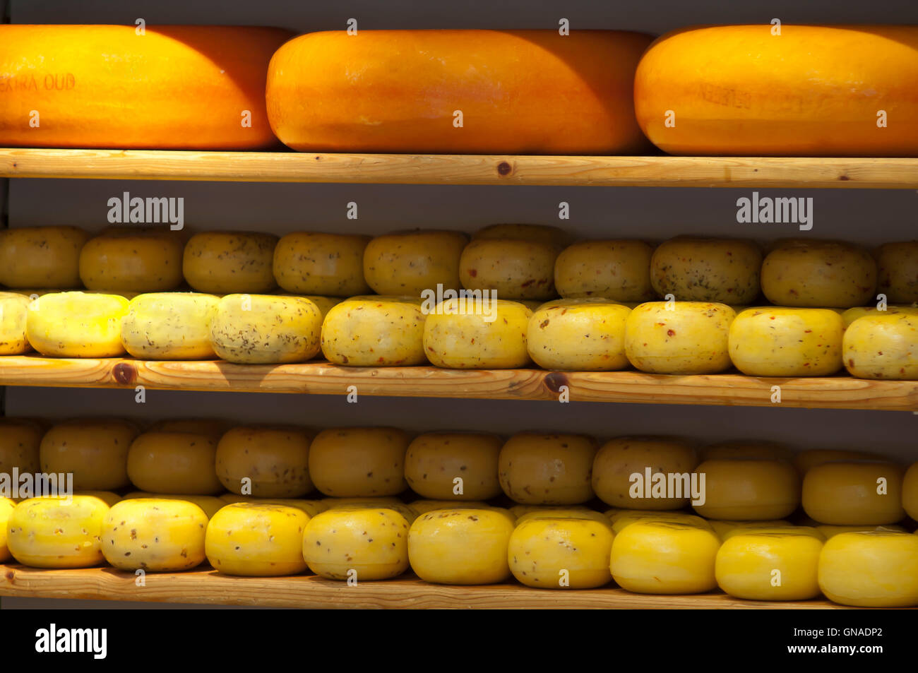 Cheese on shelves in store Stock Photo - Alamy