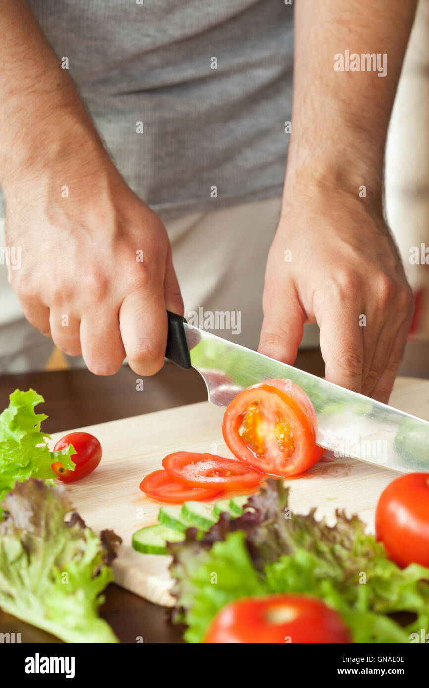 man cutting vegetables Stock Photo - Alamy