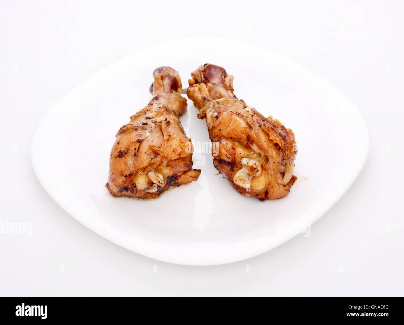 Two Fried Chicken Legs Stock Photo - Alamy