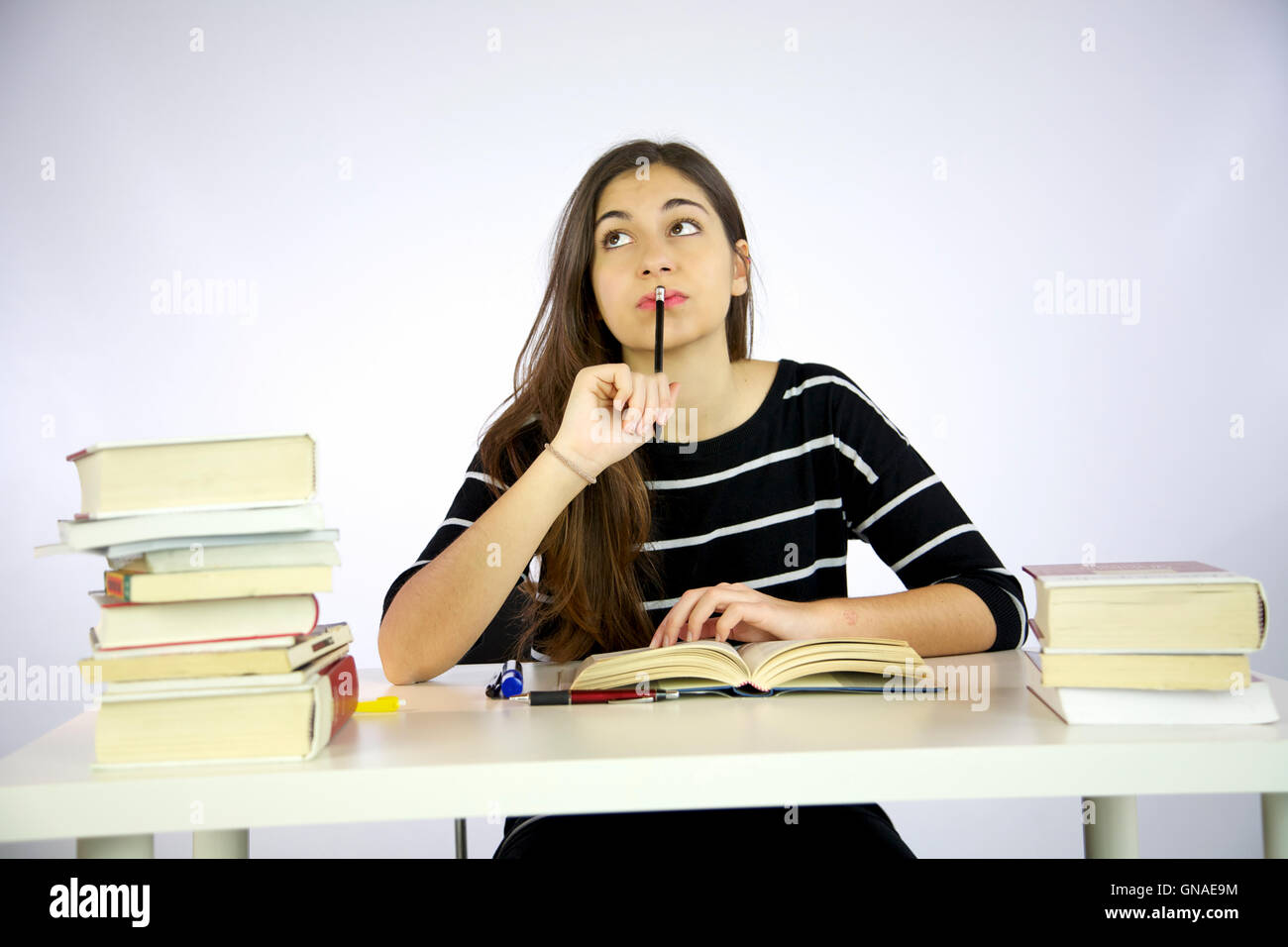 Girl studying thinking Stock Photo - Alamy