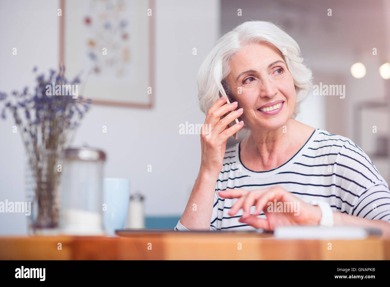 Cheerful aged woman talking hi-res stock photography and images - Alamy