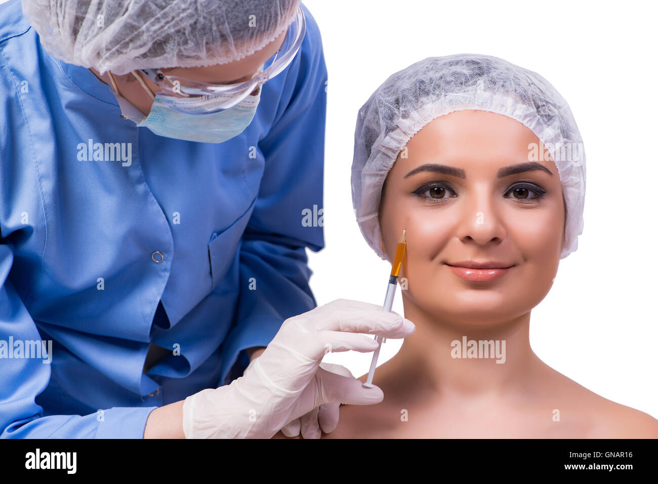 Young woman preparing for injection of botox isolated on white Stock ...