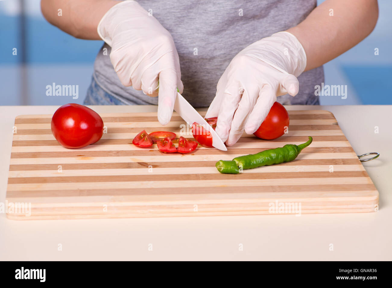 Hands of cook preparing salad Stock Photo - Alamy