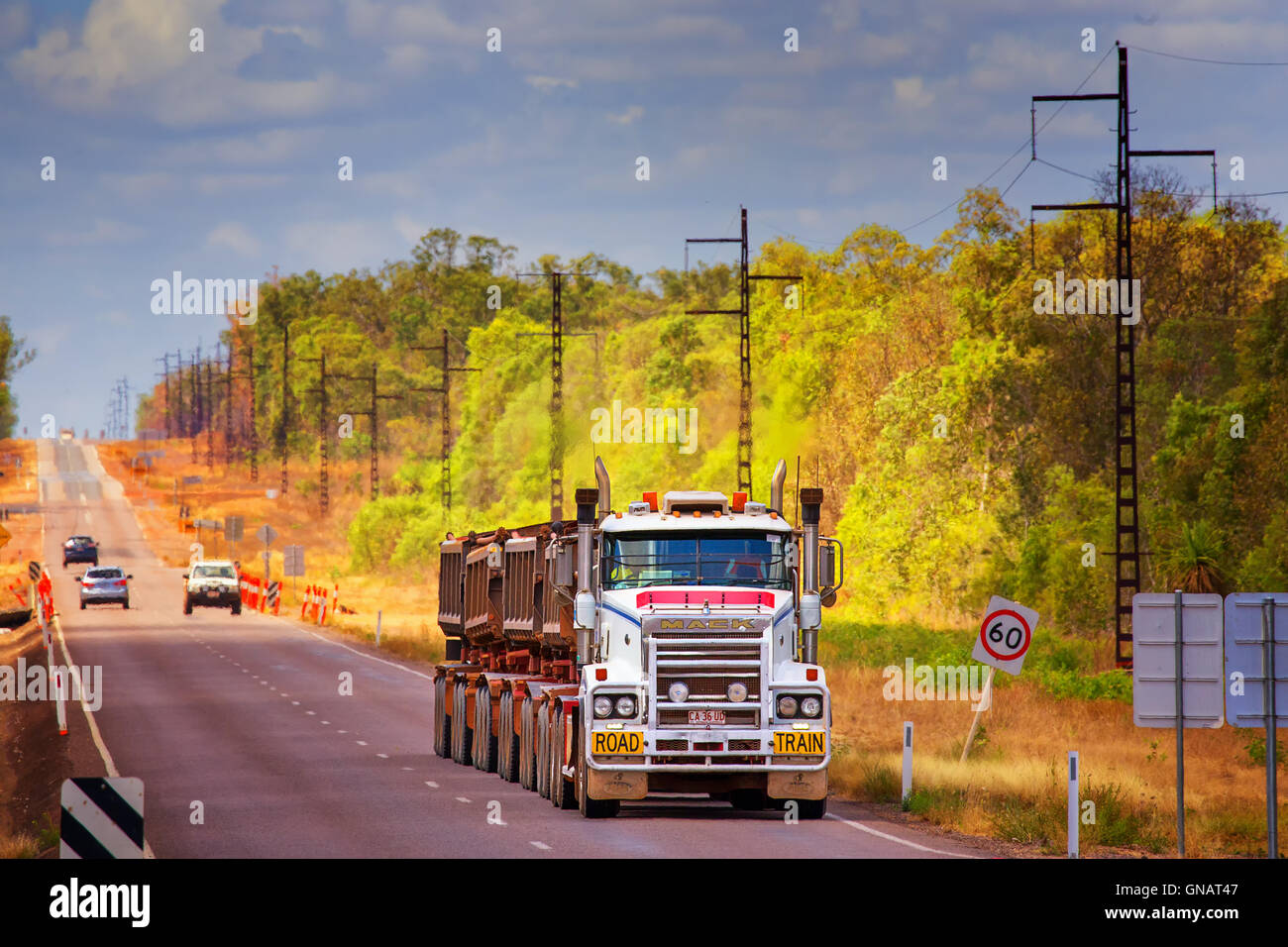 A huge road train travels along the Arnhem Highway in the Australian ... A huge road train travels along the Arnhem Highway in the Australian ...