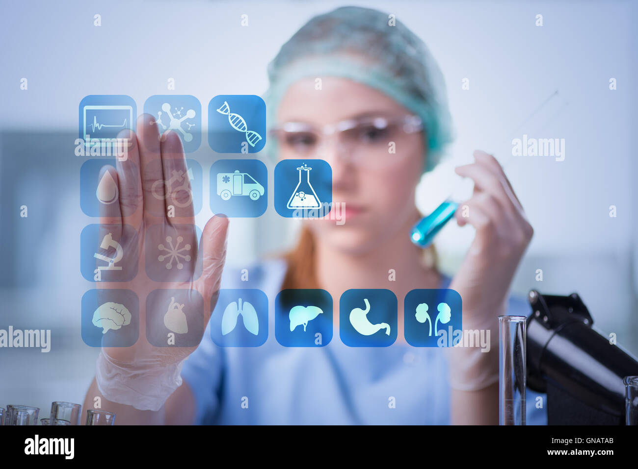 Woman doctor pressing buttons with various medical icons Stock Photo ...