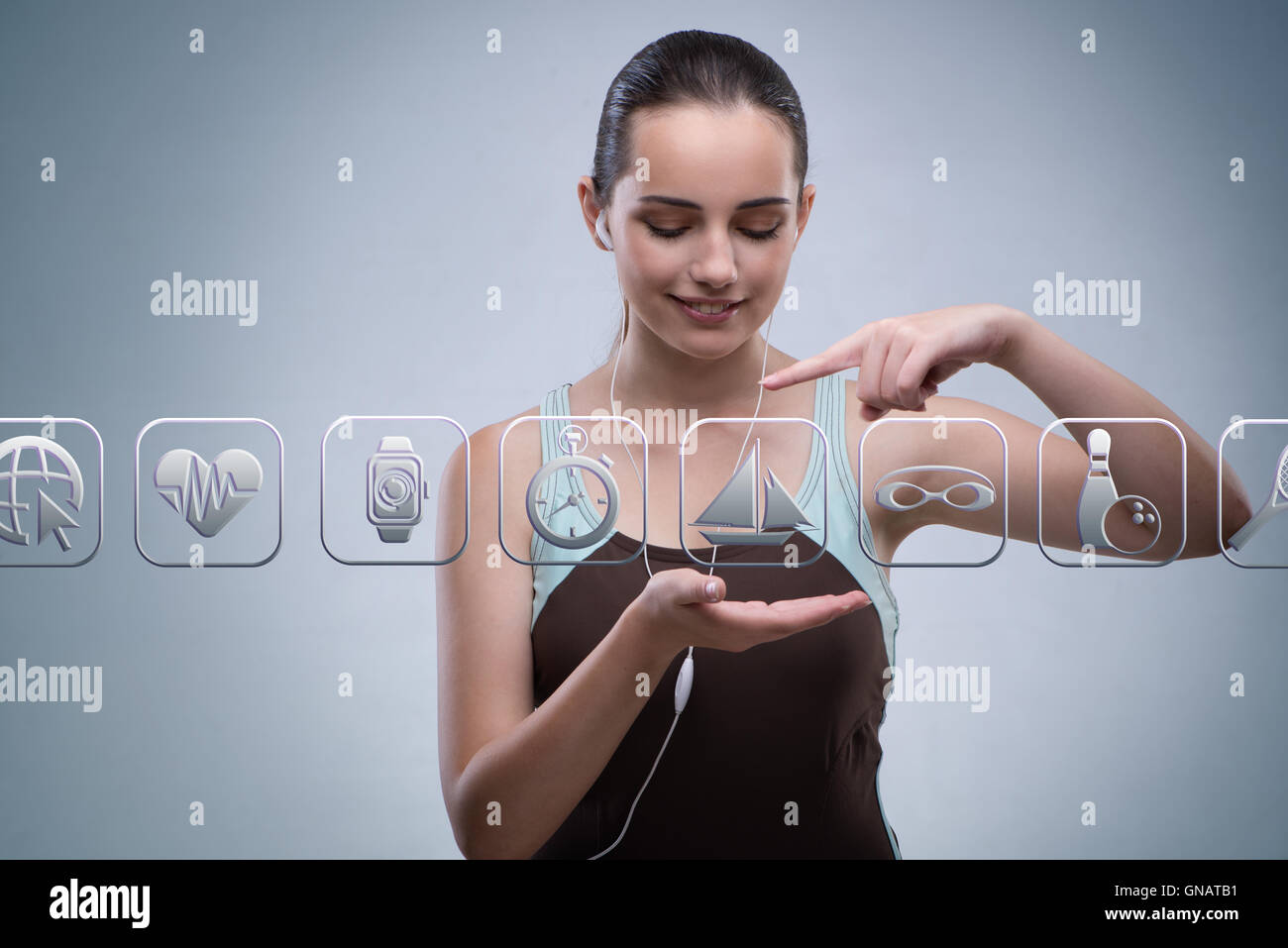 Young girl in sports concept pressing virtual buttons Stock Photo - Alamy
