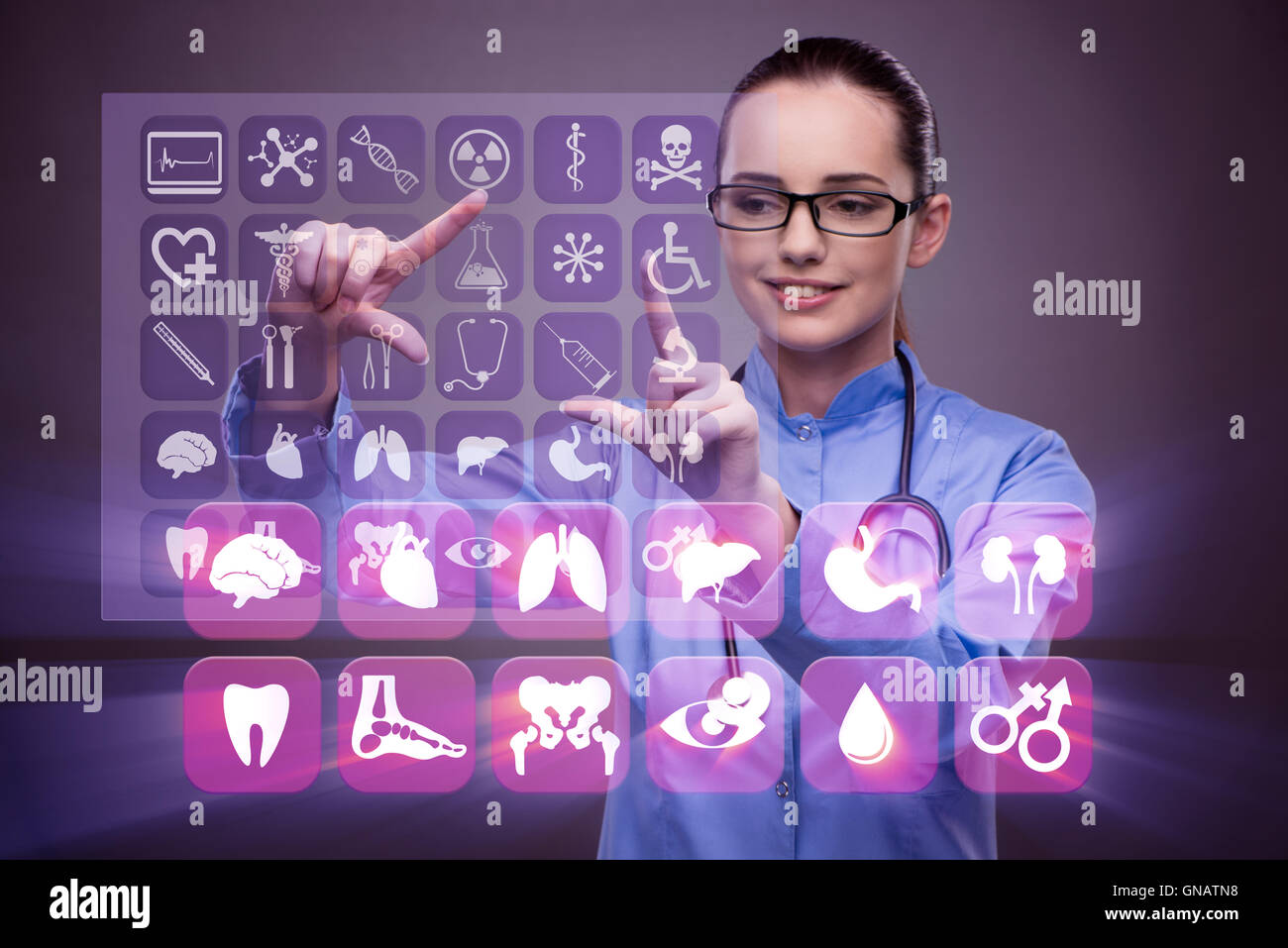 Woman doctor pressing buttons with various medical icons Stock Photo ...
