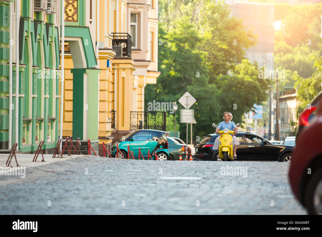 People riding on a scooter Stock Photo - Alamy