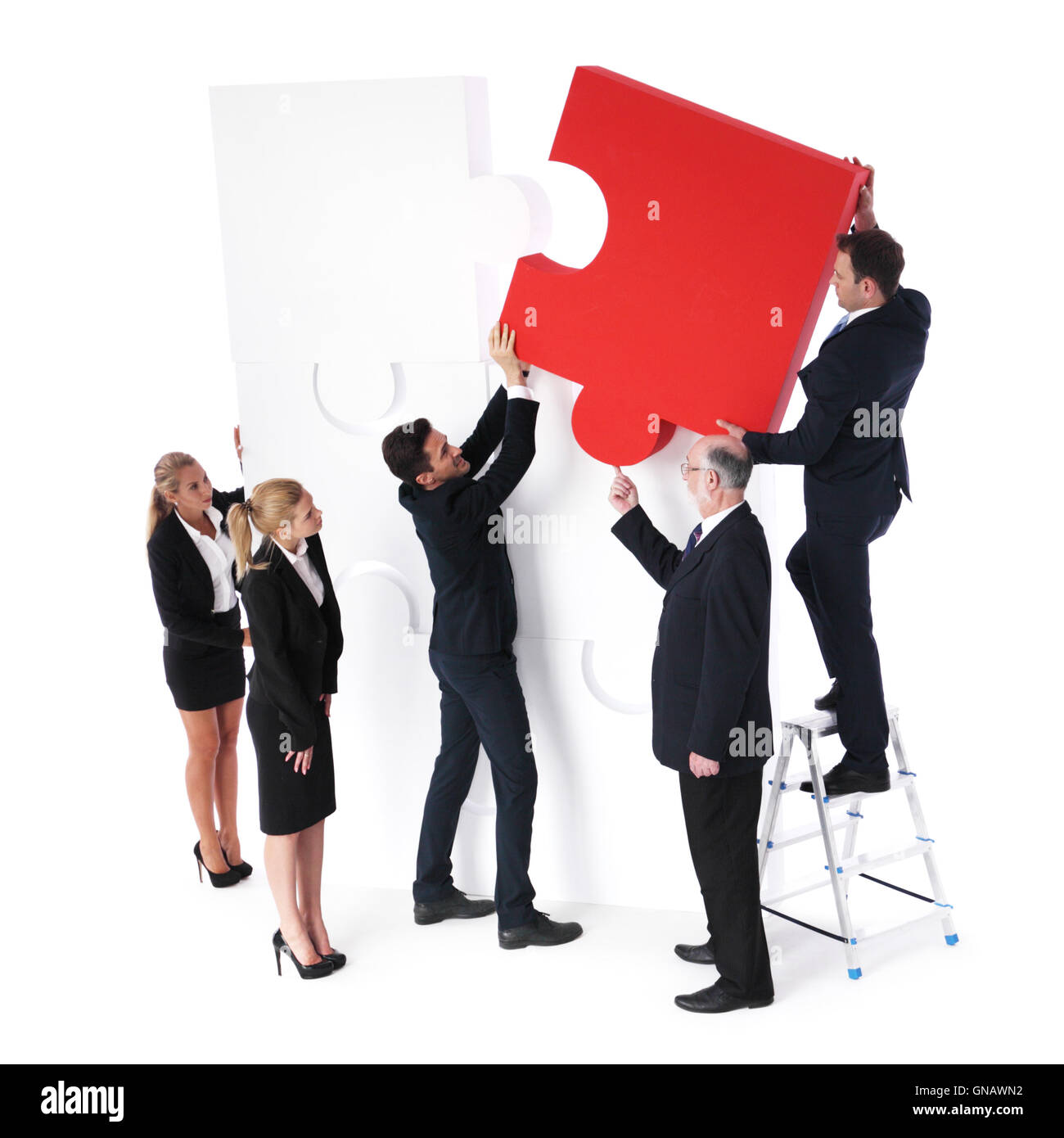 Business people solving problems assembling puzzle isolated on white ...