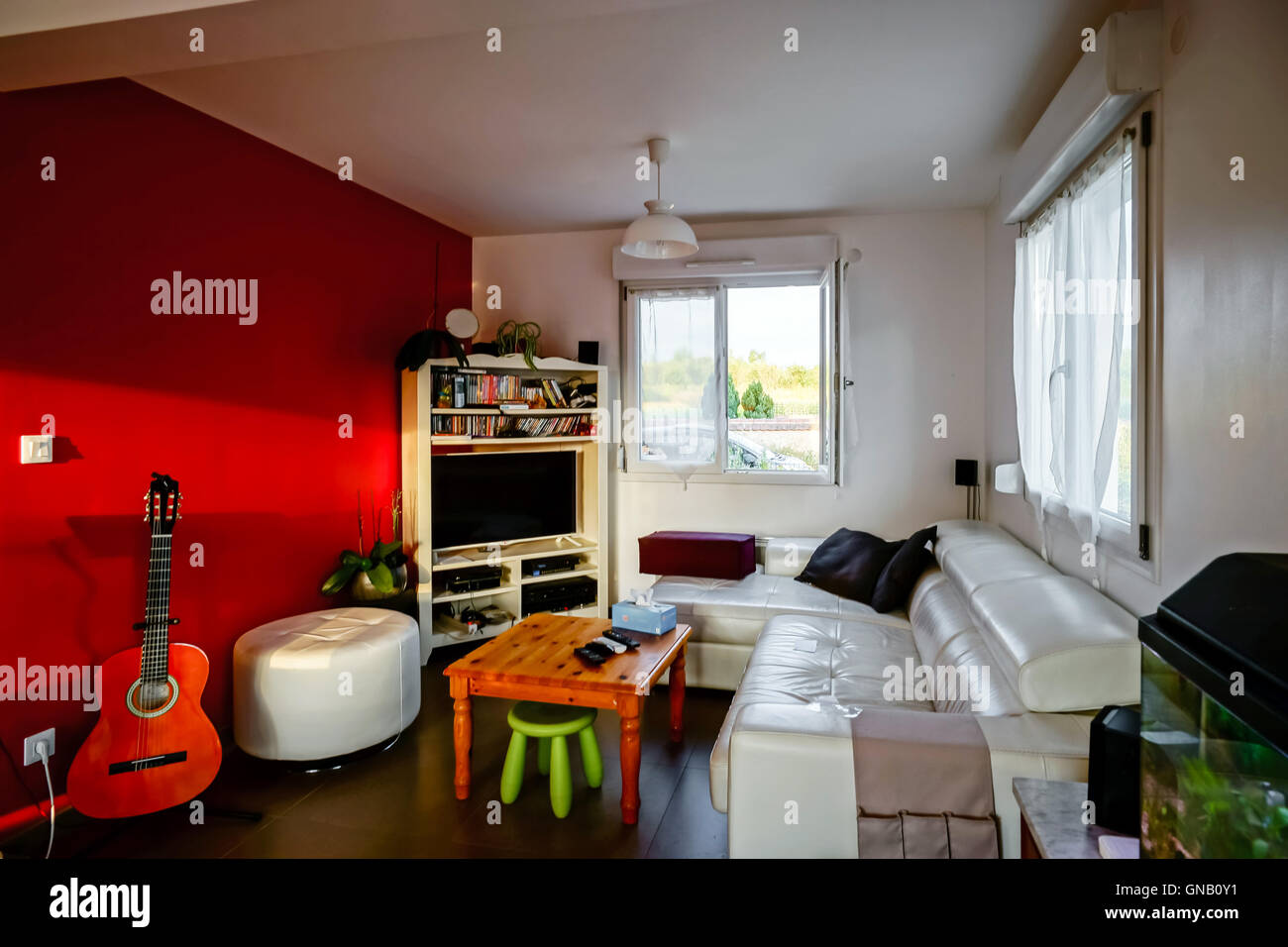 Typical suburban studio in a little house with big door to the garden ...