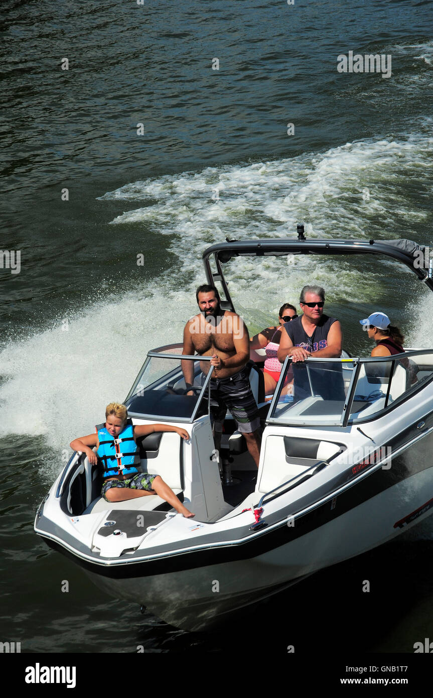 Recreational boating. Child in bow rider Stock Photo - Alamy