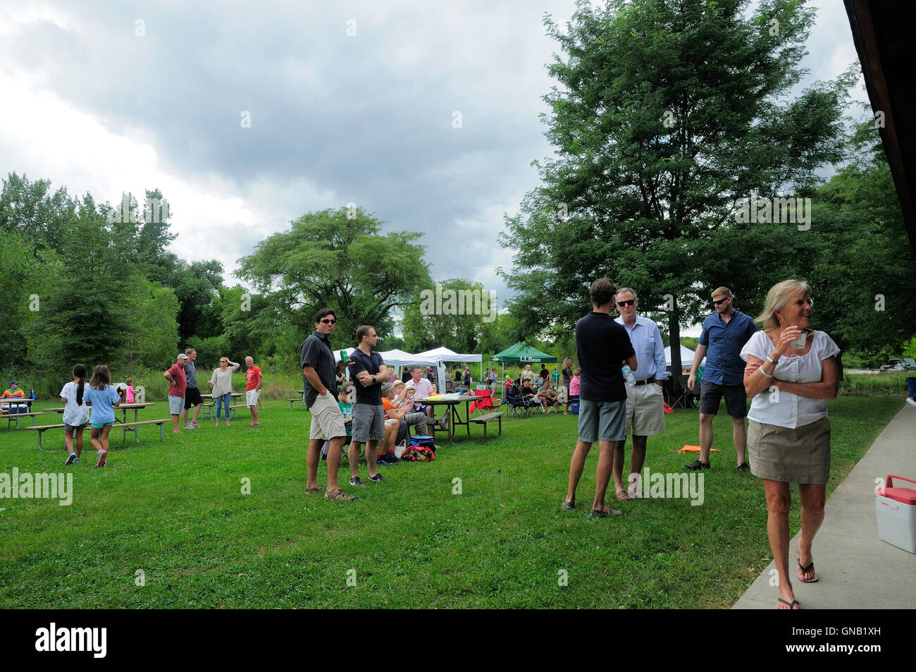 People enjoying themselves at an outdoor music festival Stock Photo - Alamy