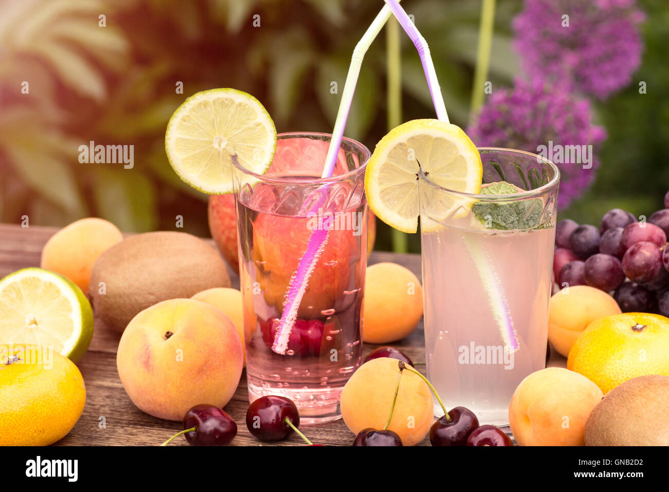 Fresh lemonade and ripe fruits Stock Photo - Alamy