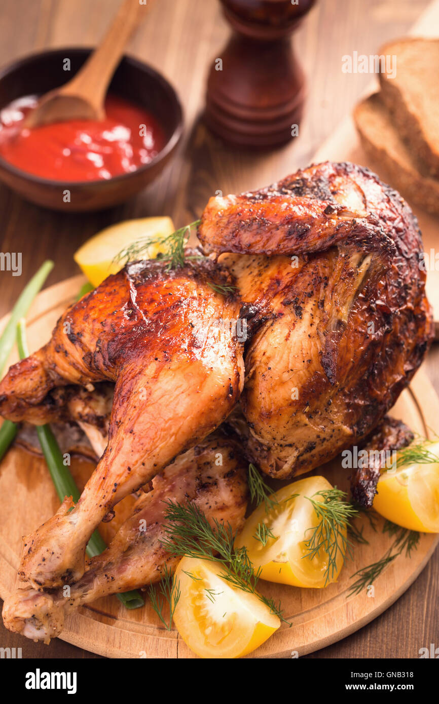 Grilled chicken on wooden plate Stock Photo - Alamy