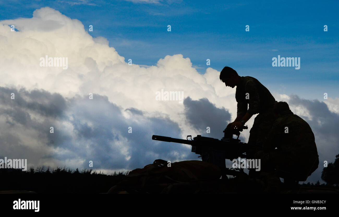 A paratrooper of the British Army Parachute Regiment prepares a 40mm ...