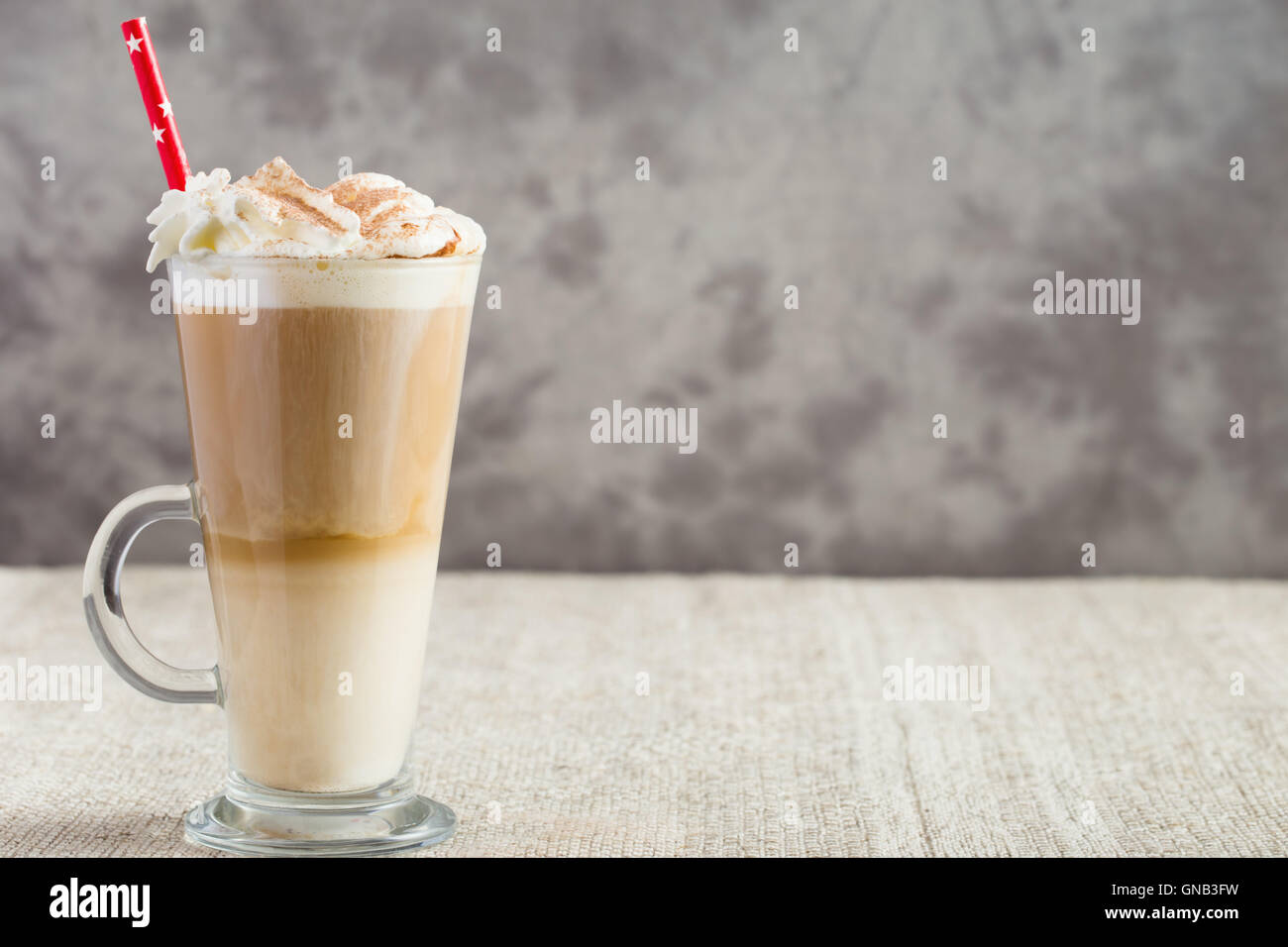 Latte coffee from left side of wooden table Stock Photo - Alamy