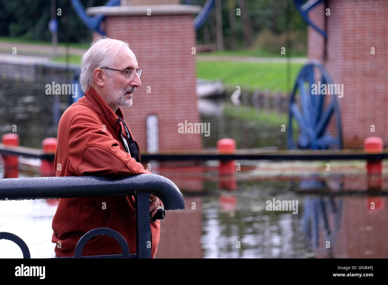 A Polish man at a cable winch and water lock platform in Buczyniec in ...