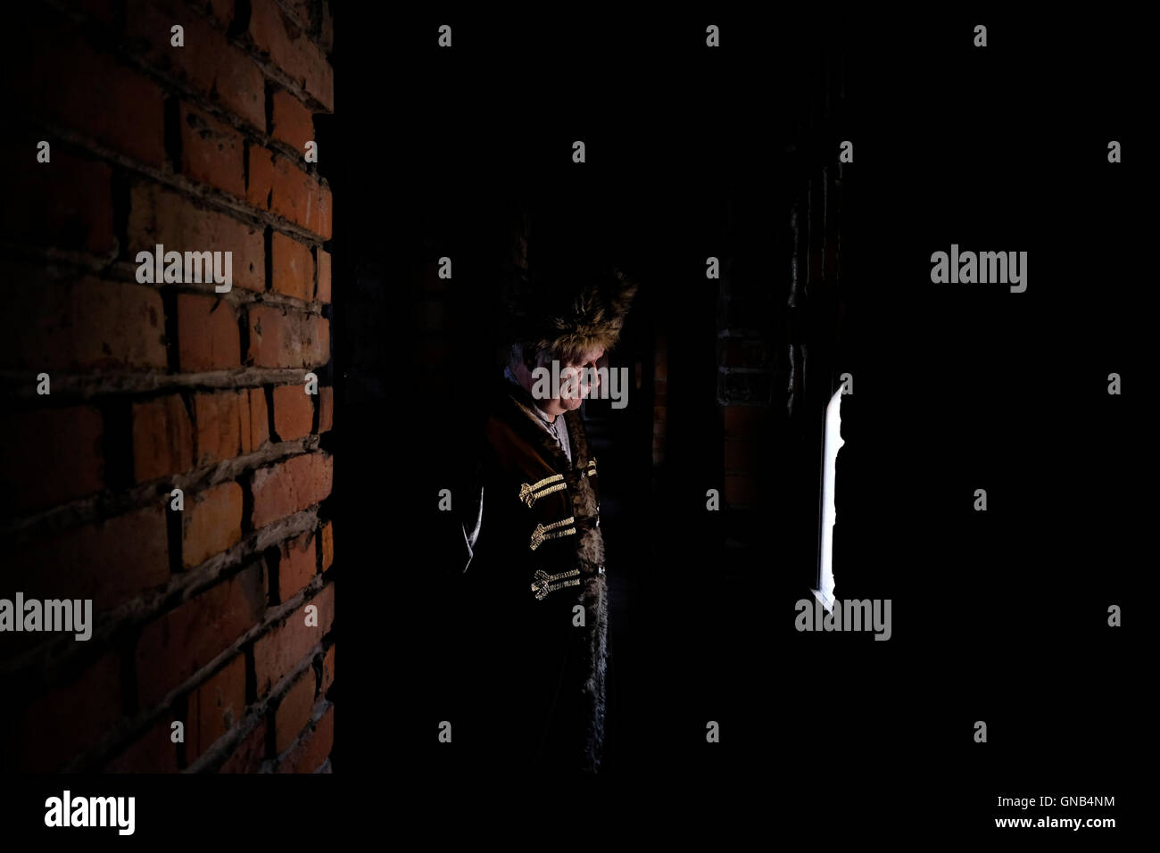 A Polish man in traditional medieval garment inside the Ordensburg ...