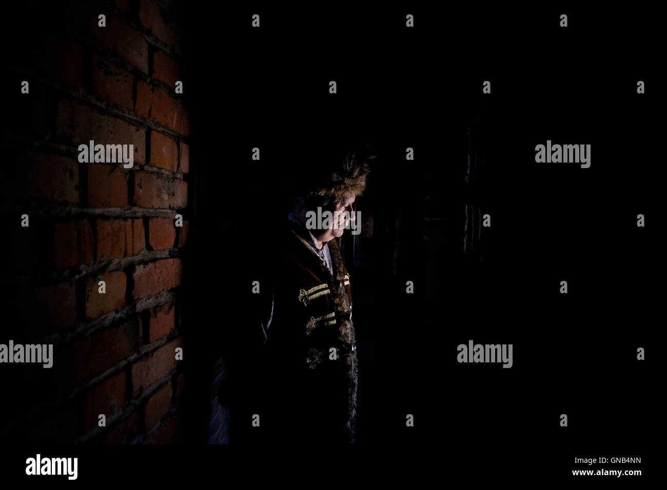 A Polish man in traditional medieval garment inside the Ordensburg ...