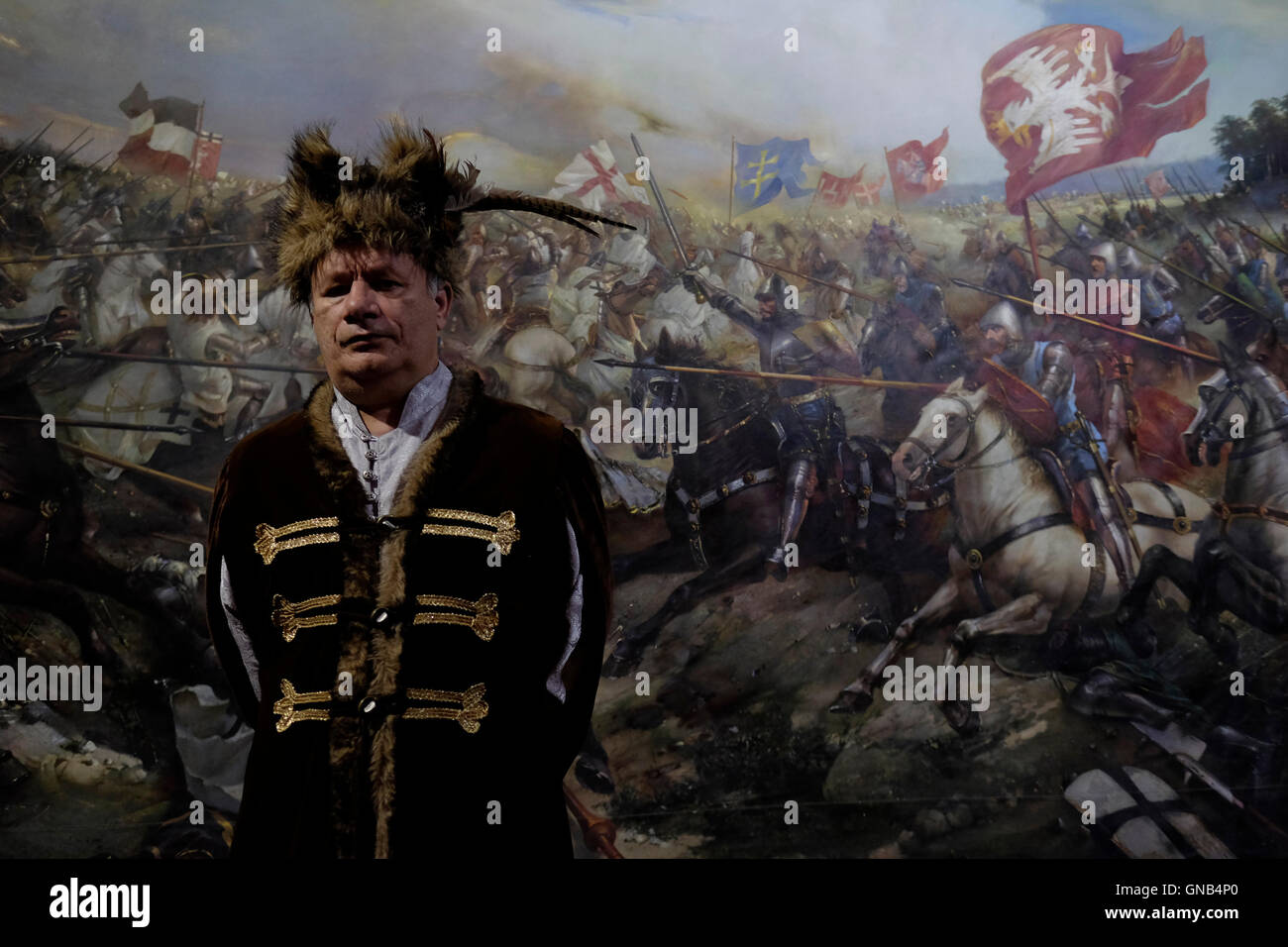 A Polish man wears traditional medieval garment inside the Ordensburg ...