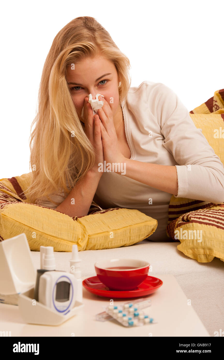 Sick woman lying in bed covered with blanket, feeling ill, has flu and ...