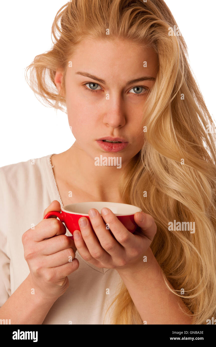 Sick woman drinking tea isolated over white background Stock Photo - Alamy