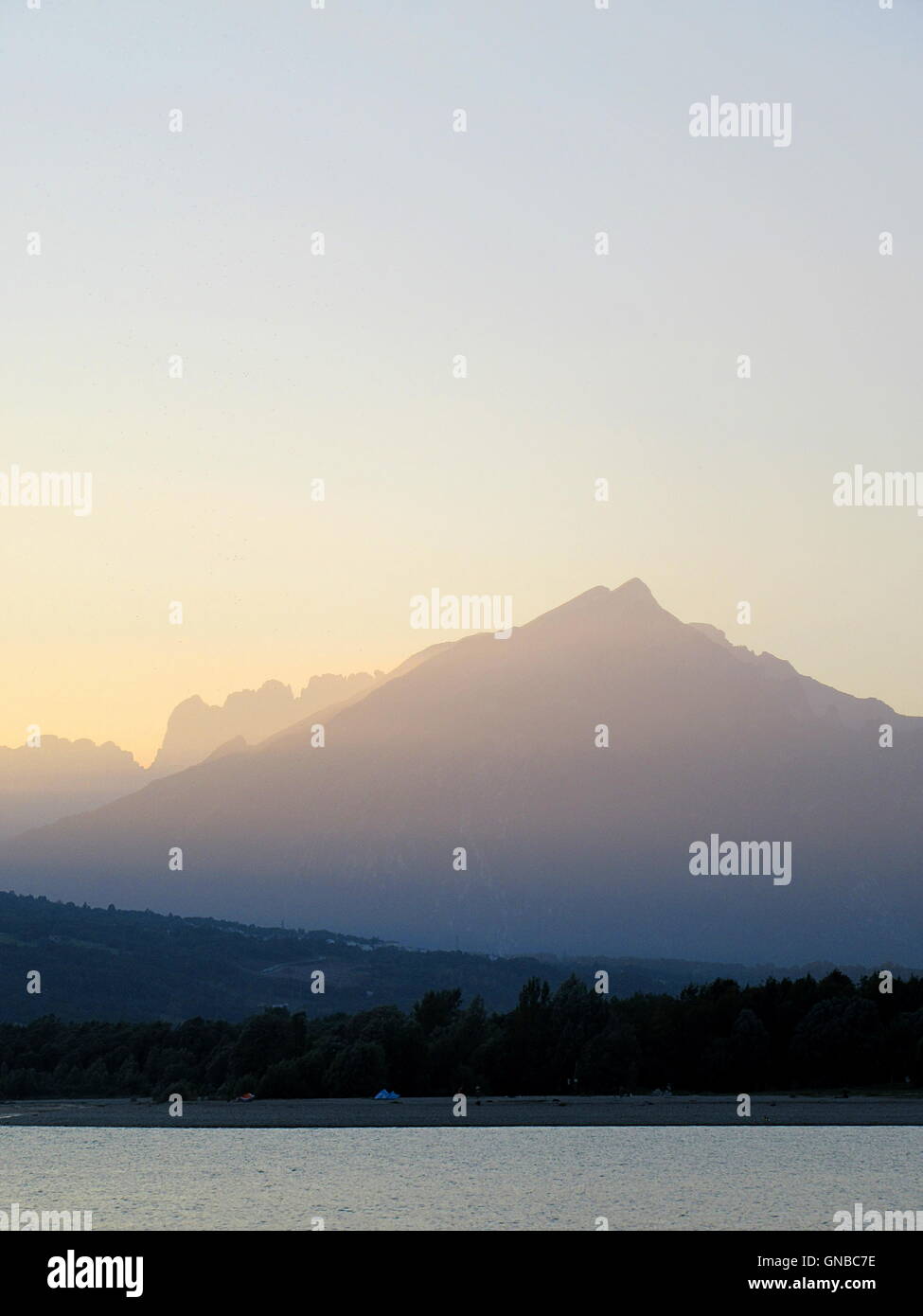 Full frame shot of sunset landscape with mountain, lake and forest ...