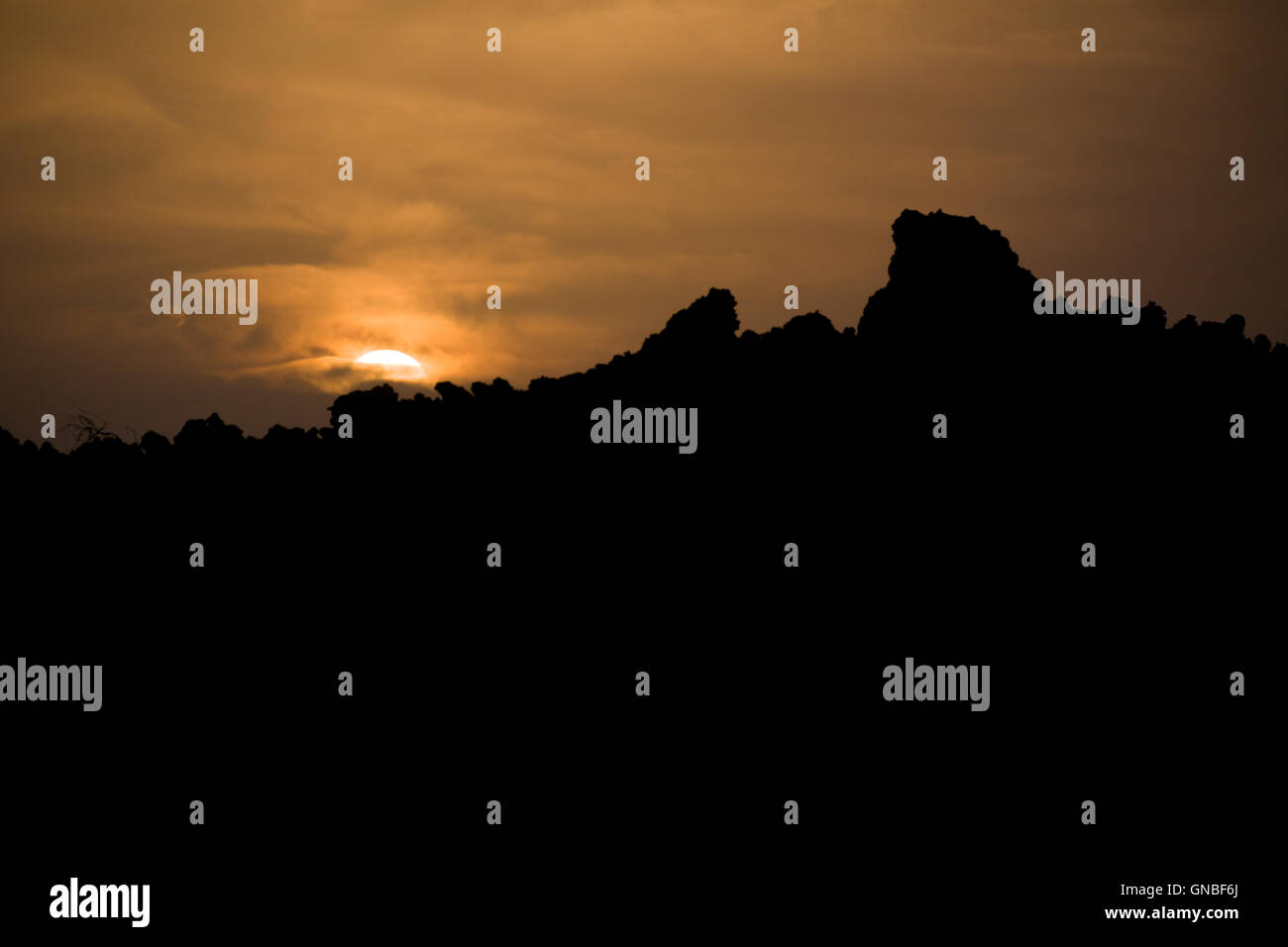 Sunset over volcano Stock Photo - Alamy