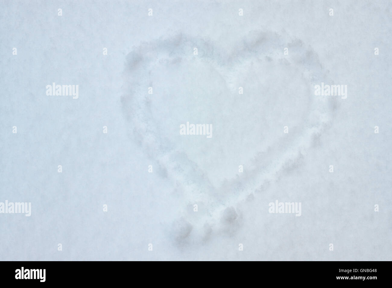 Sign of love in snow Stock Photo - Alamy