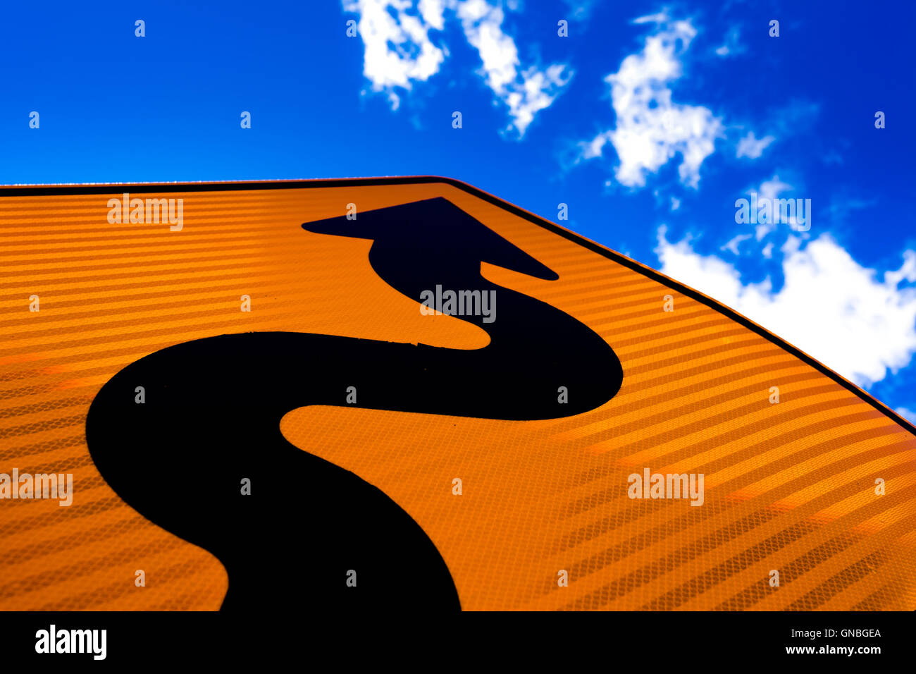 Wavy arrow on road sign pointing up for success Stock Photo - Alamy