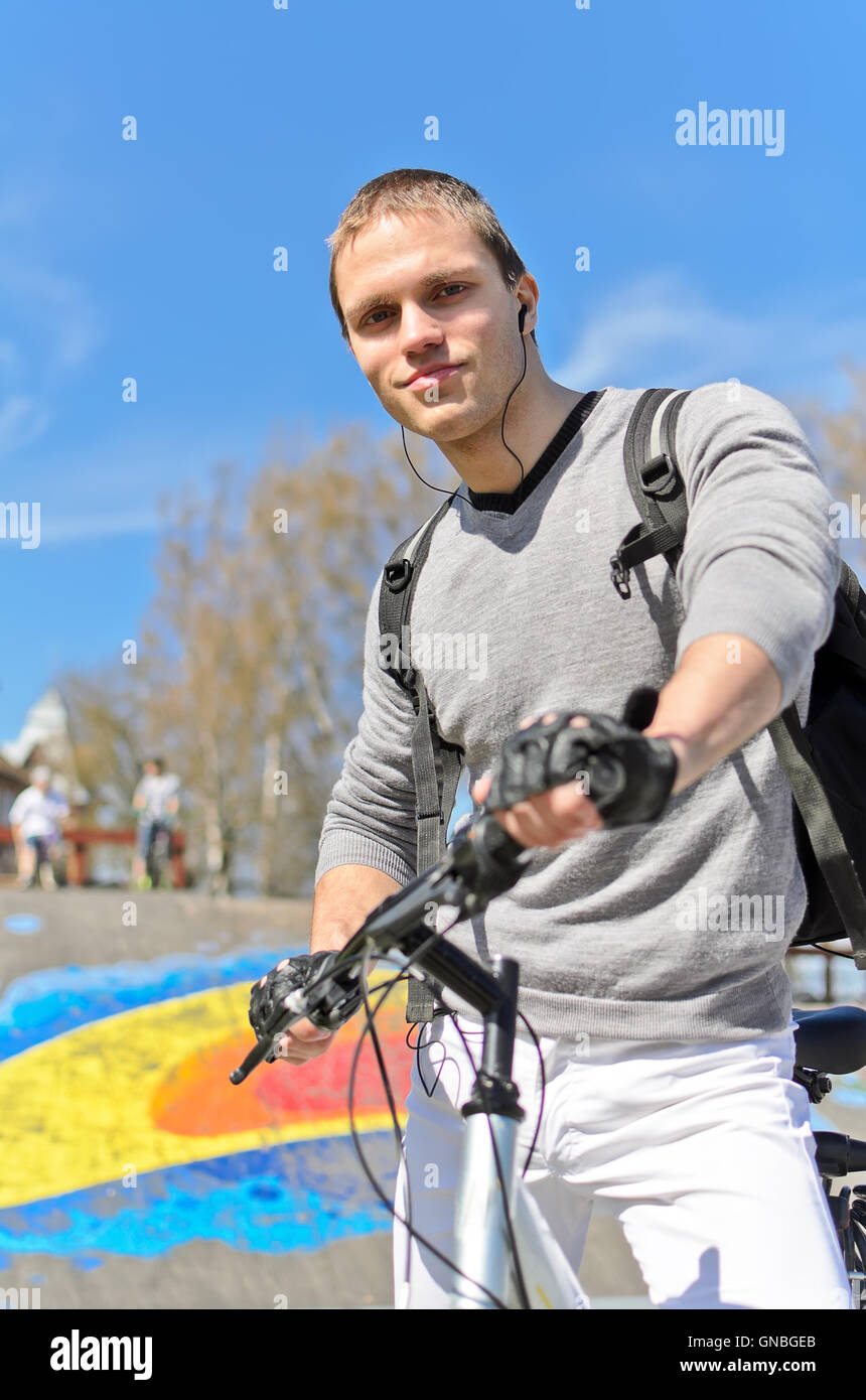 Portrait of BMX bicycle rider on urban skatepark background Stock Photo ...