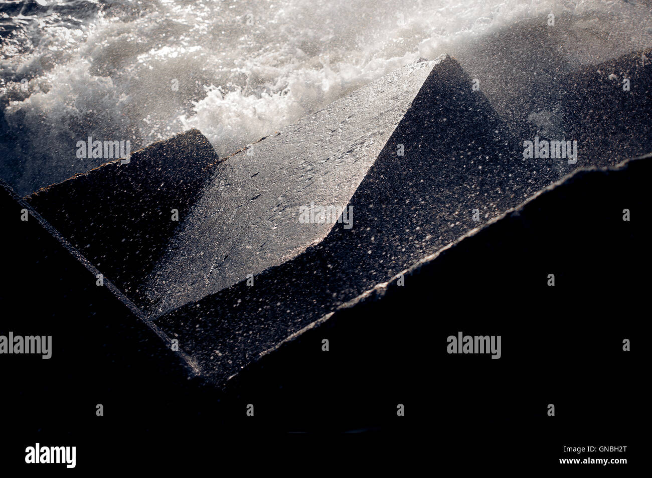 Tidal wave with 5 concrete blocks Stock Photo - Alamy