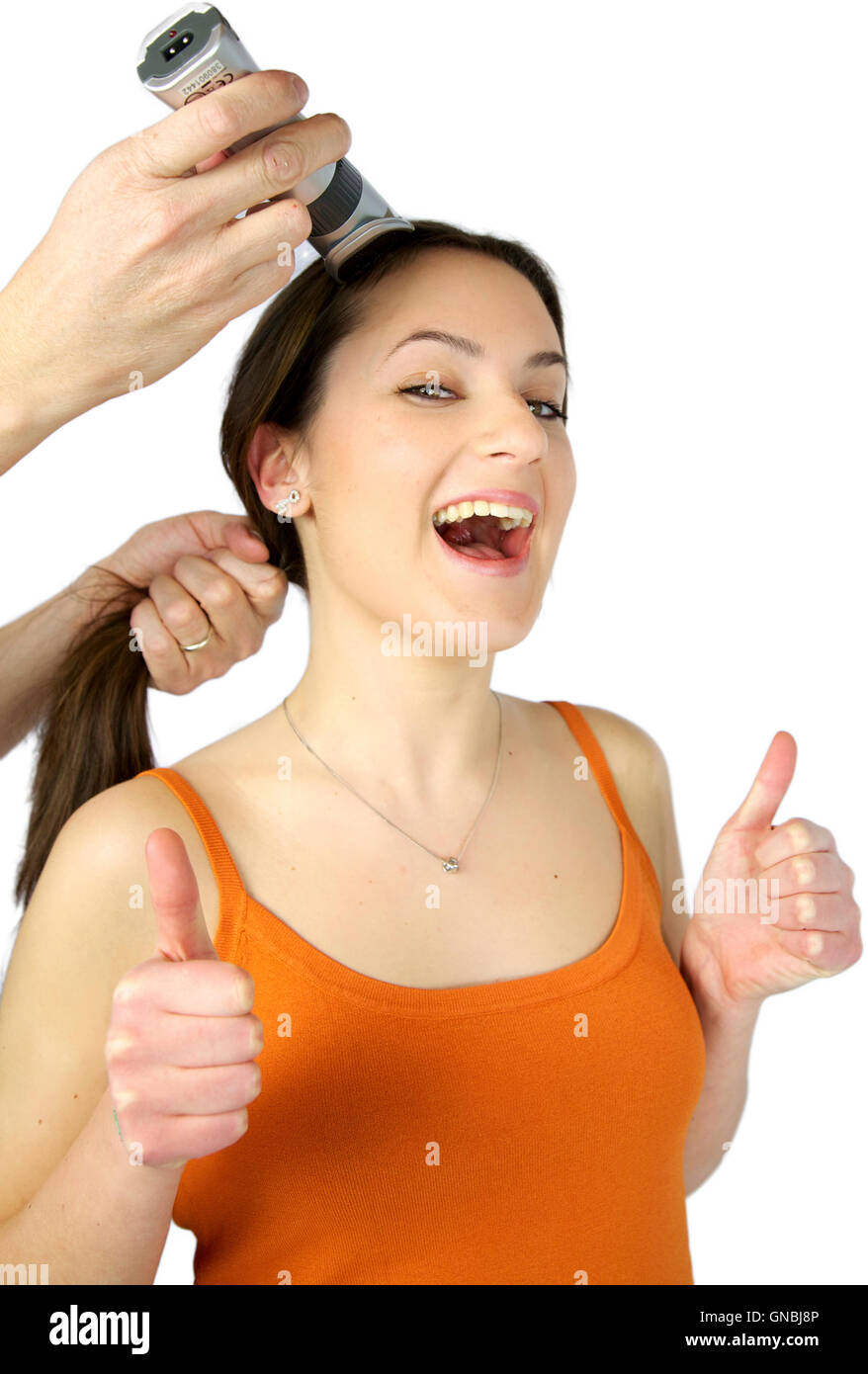 Girl getting hair buzzed happy Stock Photo - Alamy