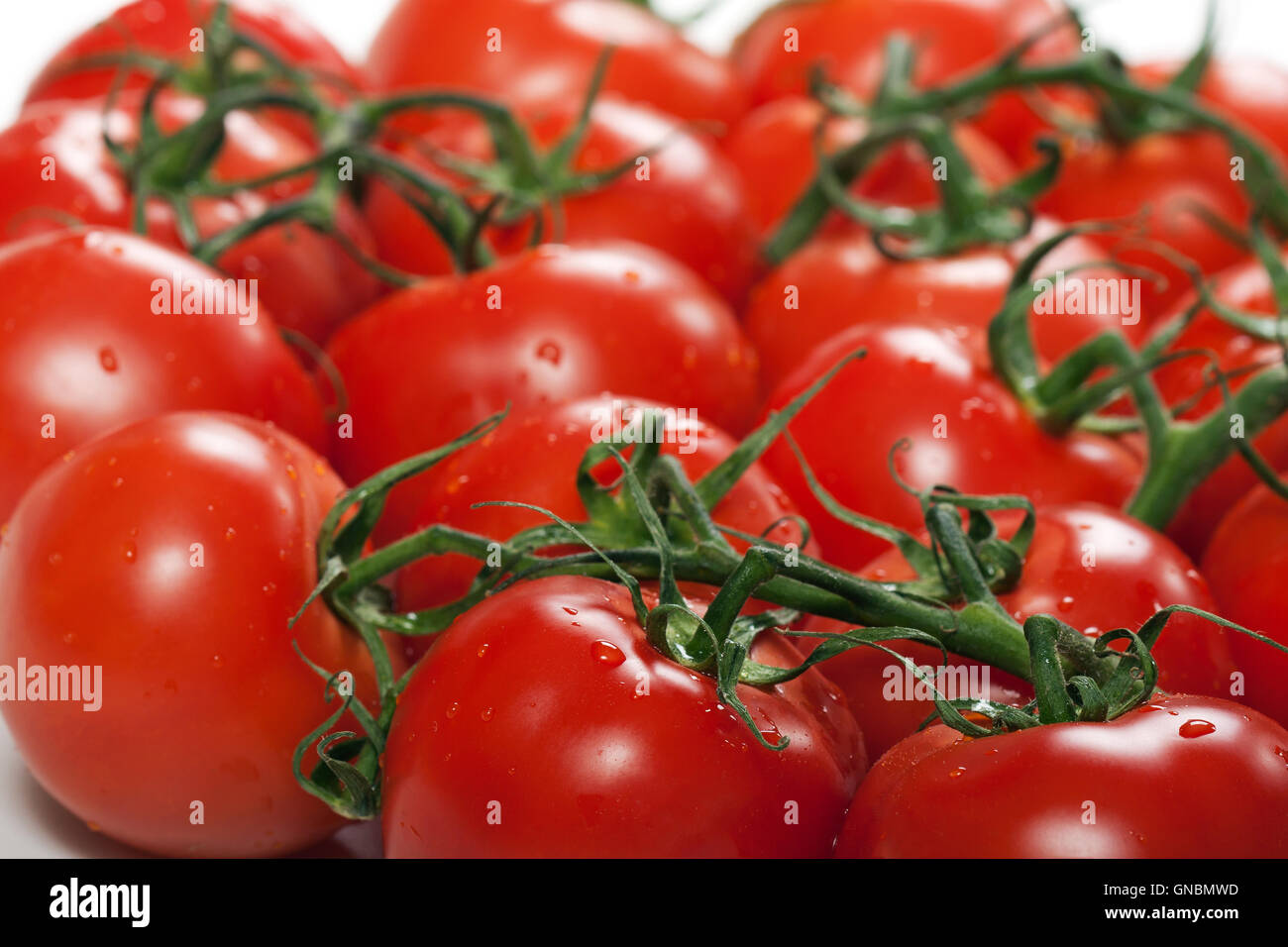Red tomato with stem hi-res stock photography and images - Alamy