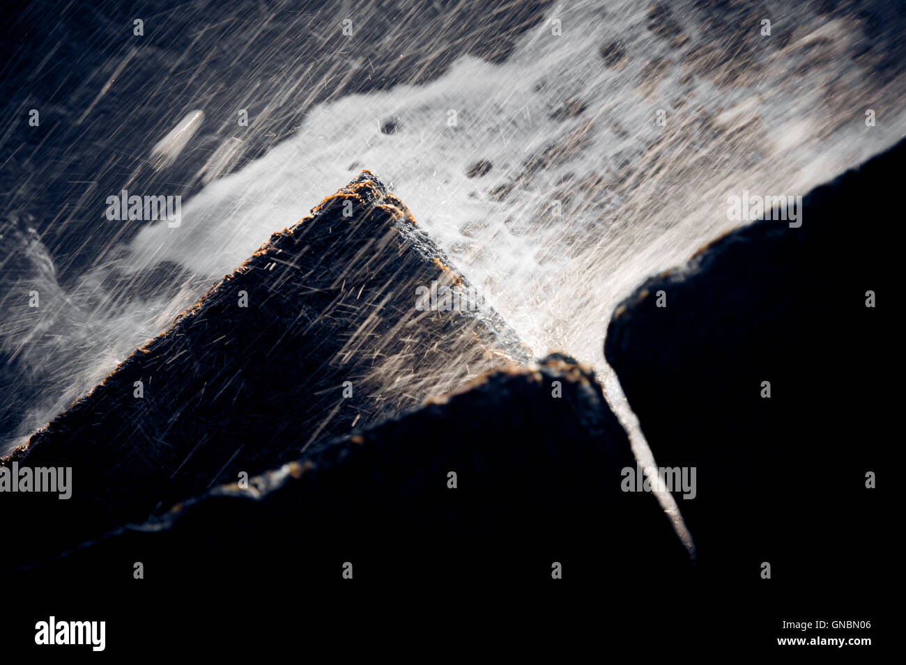 Tidal wave with 3 concrete blocks Stock Photo - Alamy