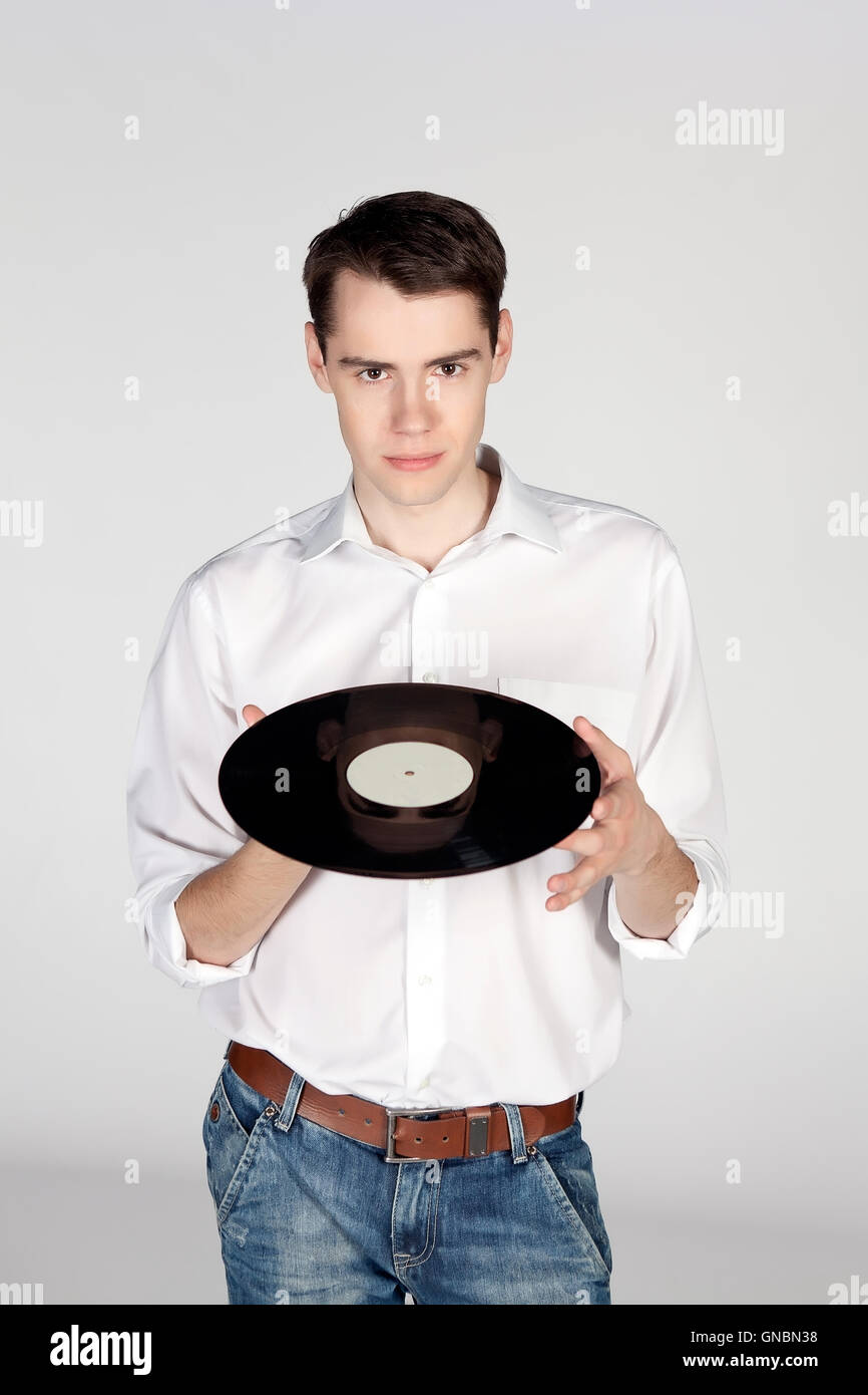 young man with a vinyl disc Stock Photo - Alamy