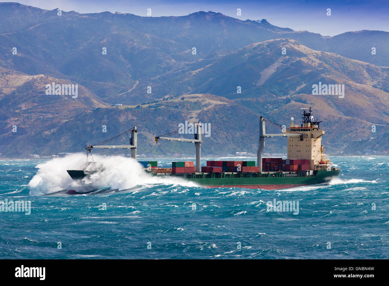 Loaded container freight ship in stormy sea Stock Photo - Alamy
