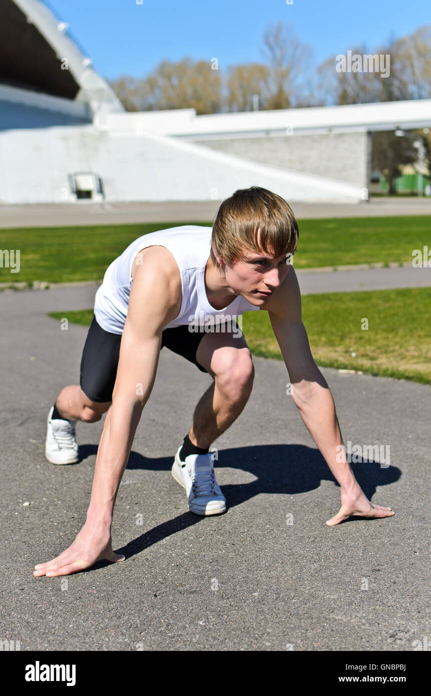 Young athletic man ready to run Stock Photo - Alamy
