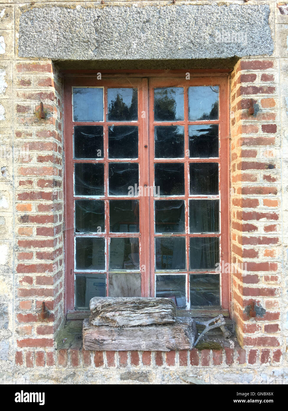 It's a photo of an old window on a stone building in Normandy Stock ...