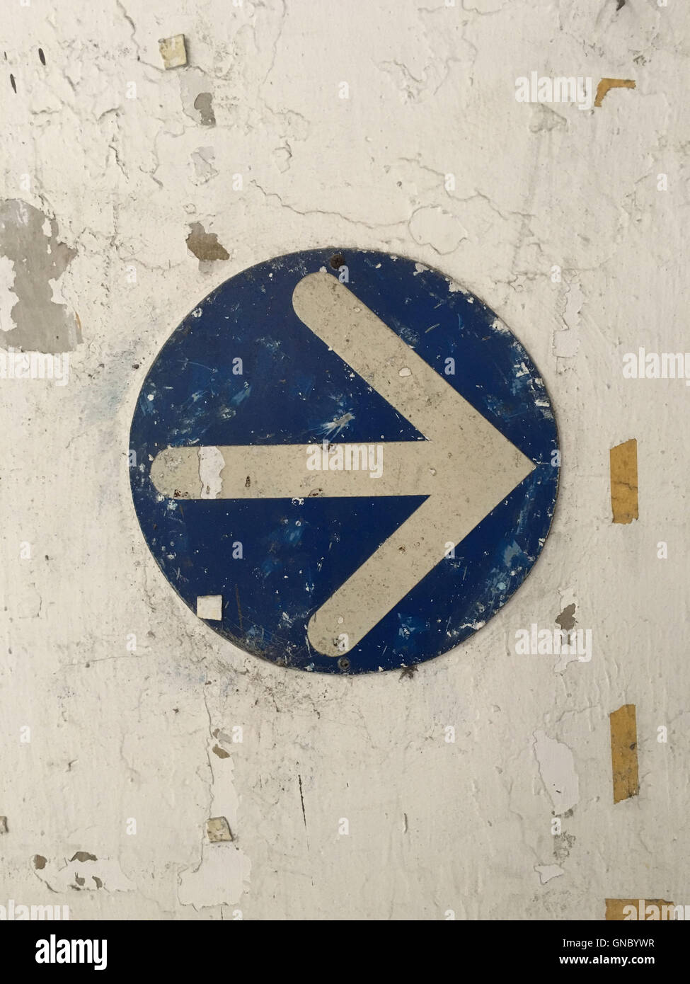 Road Sign with white arrow showing direction turning right Stock Photo ...