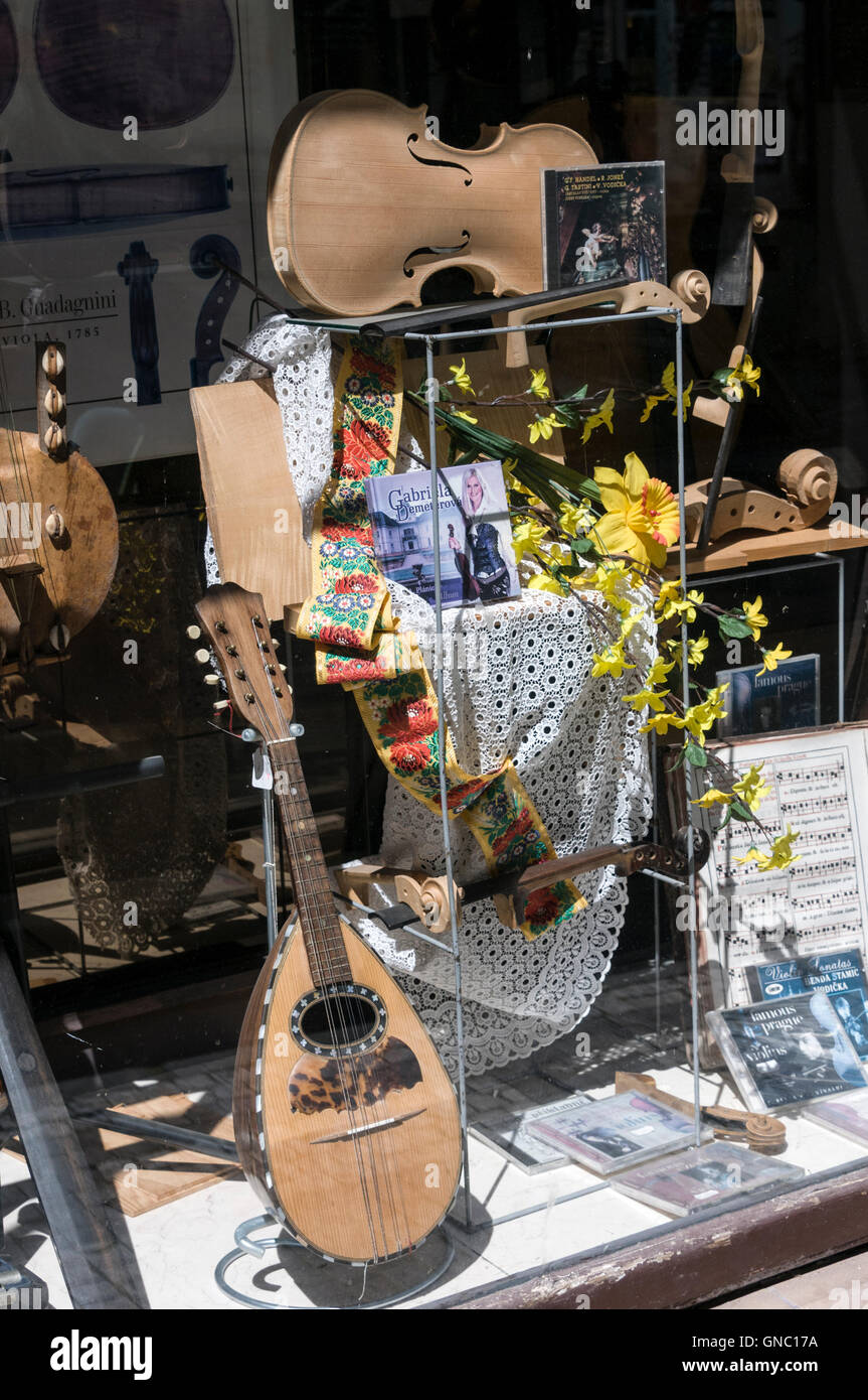 A musical instrument dealer with a window display of old and new ...