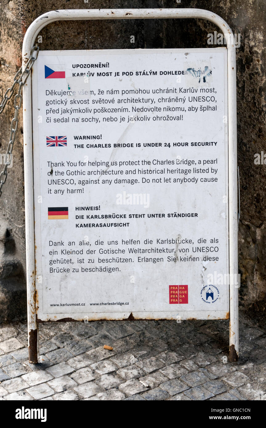 A tourist warning notice at each end of Charles Bridge in Prague, Czech ...