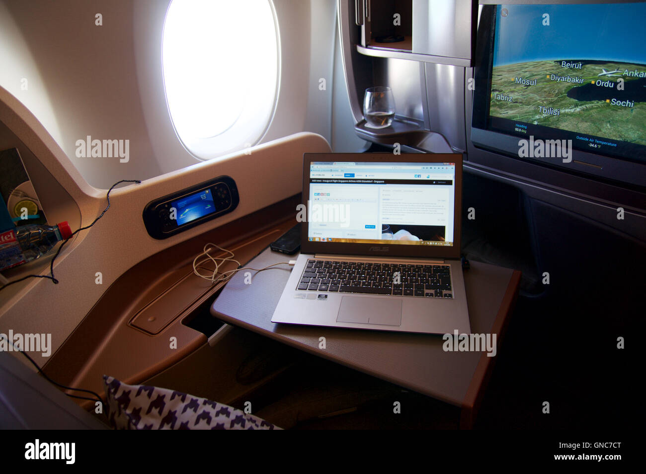 SINGAPORE - JULY 22, 2016: Business Class in the Airbus A350, working ...