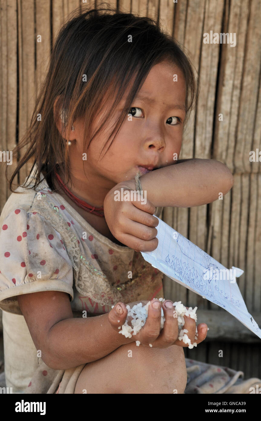 Hmong Village, School Girl Eating Rice Stock Photo - Alamy