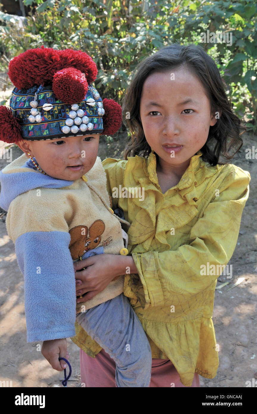 Yao Village, Girl With Young Boy Stock Photo - Alamy