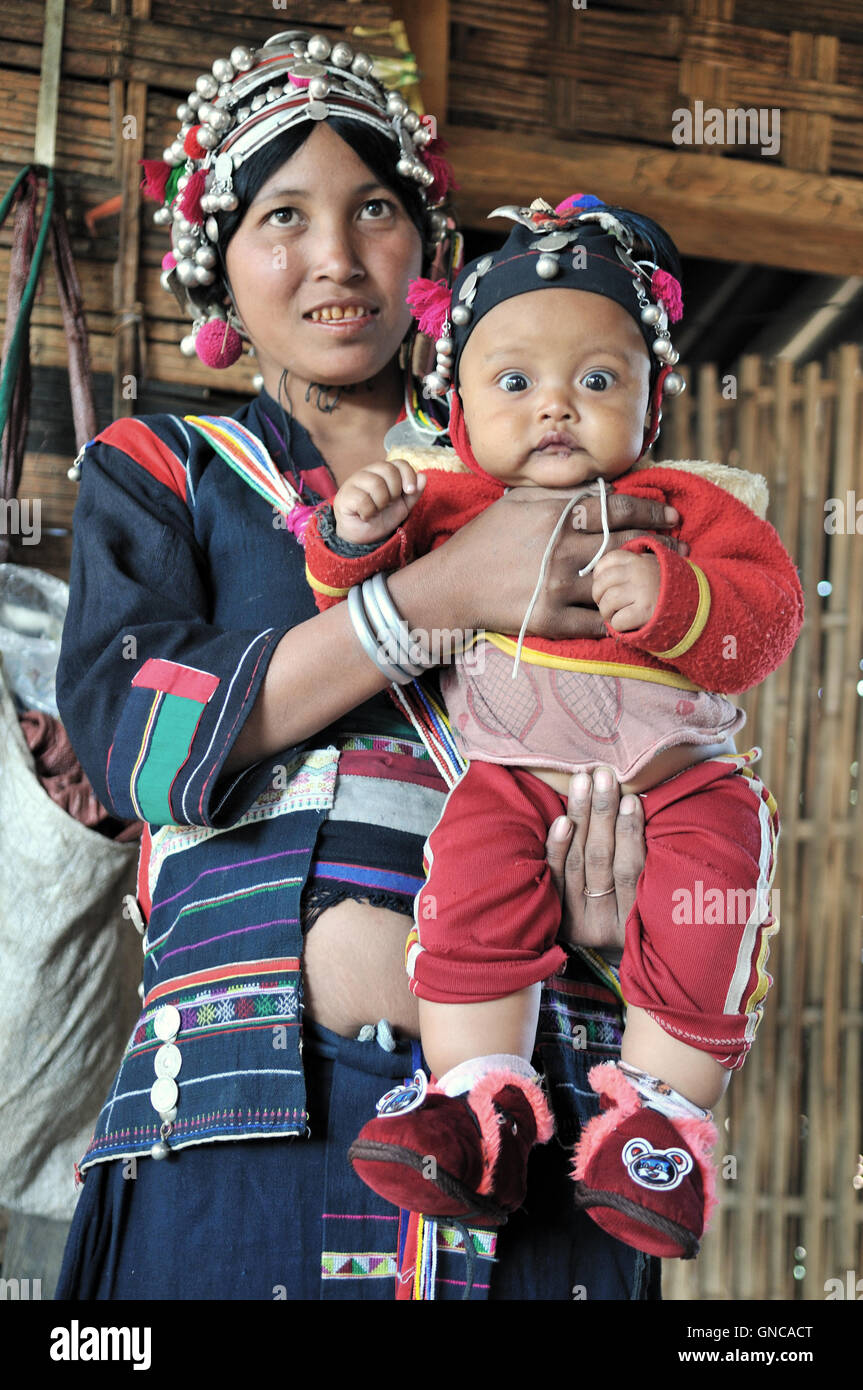 Akha Lady Wearing Traditional Dress With Silver Coins and Baby Stock ...